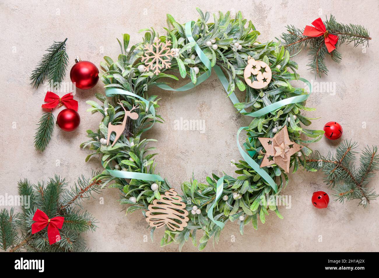 Beautiful mistletoe wreath on grunge background Stock Photo - Alamy