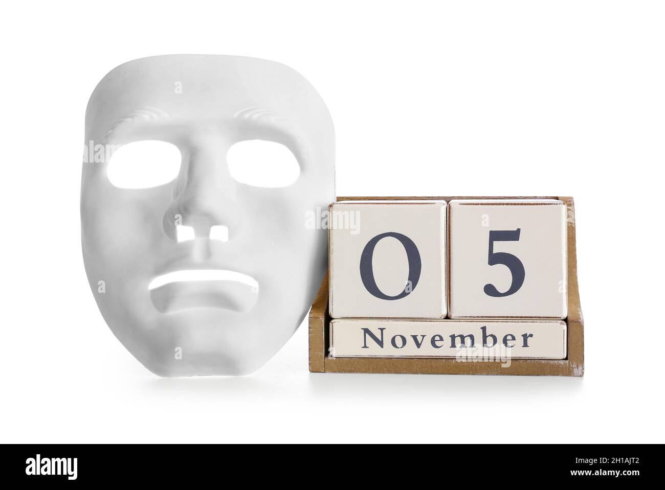 Guy Fawkes mask and calendar with date of November 5 on white ...