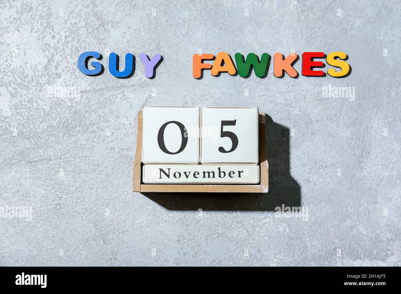 Text GUY FAWKES and calendar with date of November 5 on grunge ...