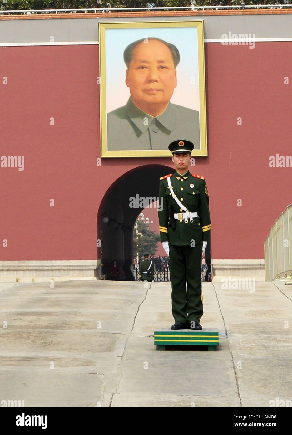 A Chinese military guard standing under the Mao Zedong at the Tiananmen ...