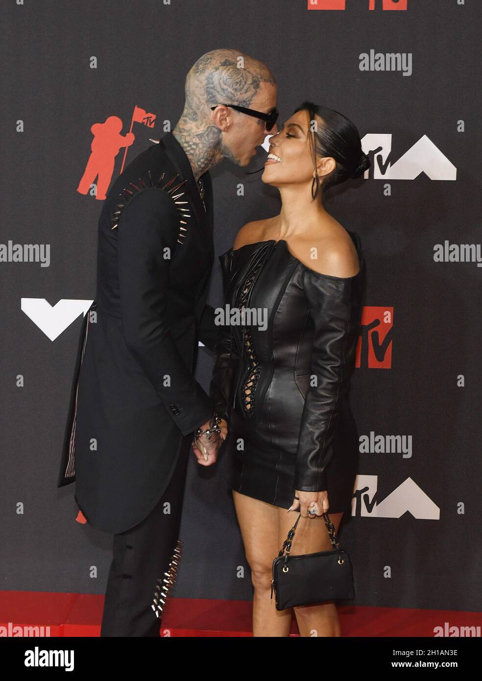 Travis Barker, Kourtney Kardashian are seen kissing on the red carper ...