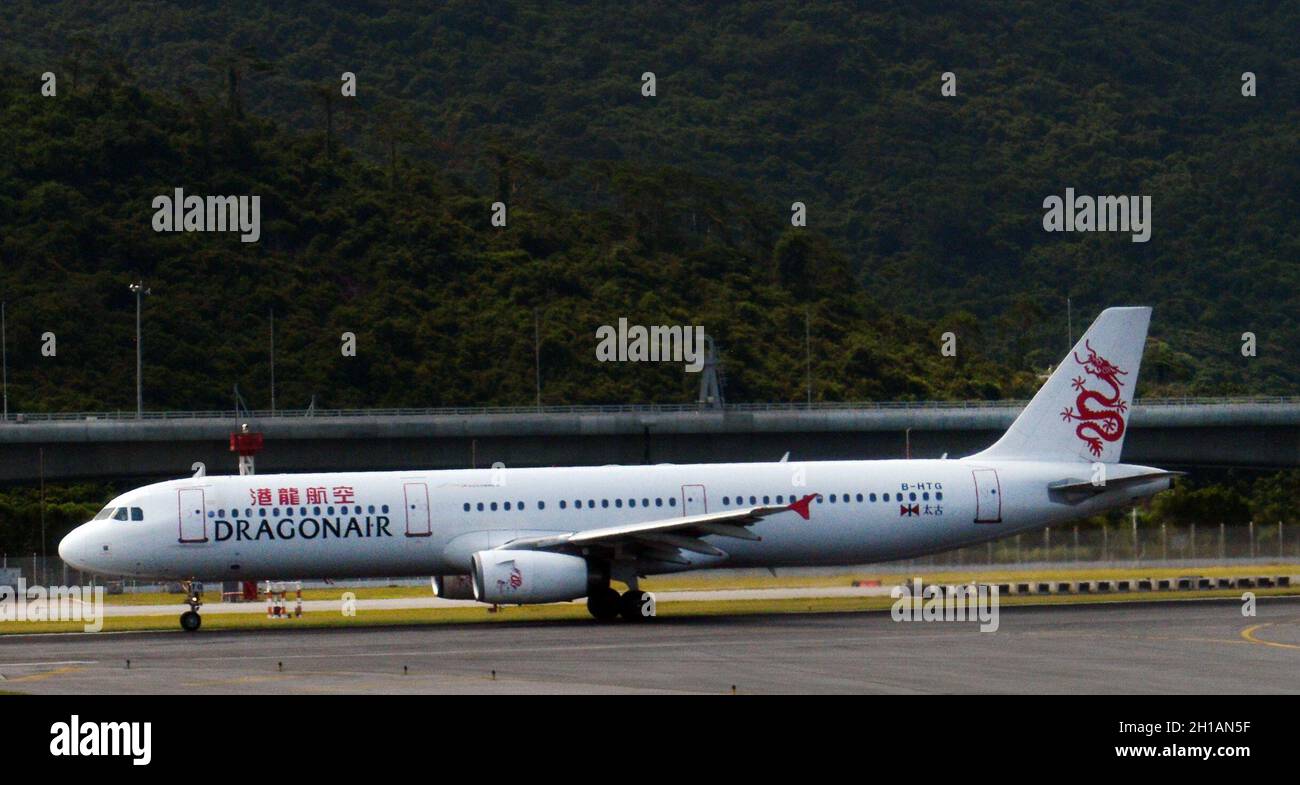 Dragon Air airplane on the tarmac at Hong Kong international airport ...
