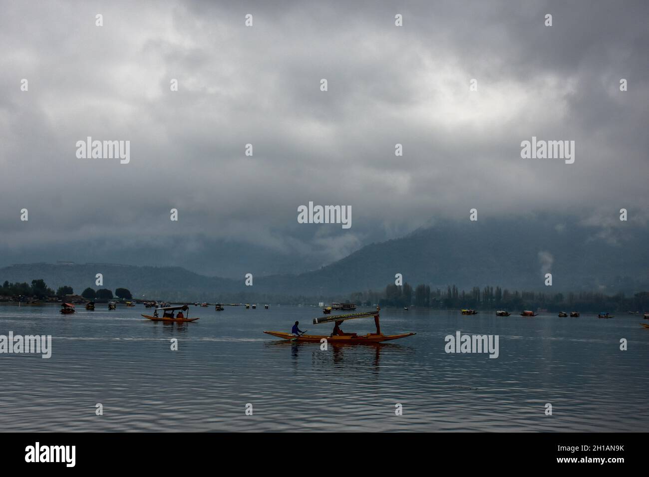 Srinagar, India. 17th Oct, 2021. Boatmen seen ferrying tourists across the Dal lake during a ...