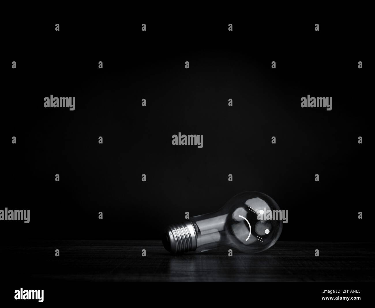 Uninspired concept, no idea like light off. Light bulb with sad face ...