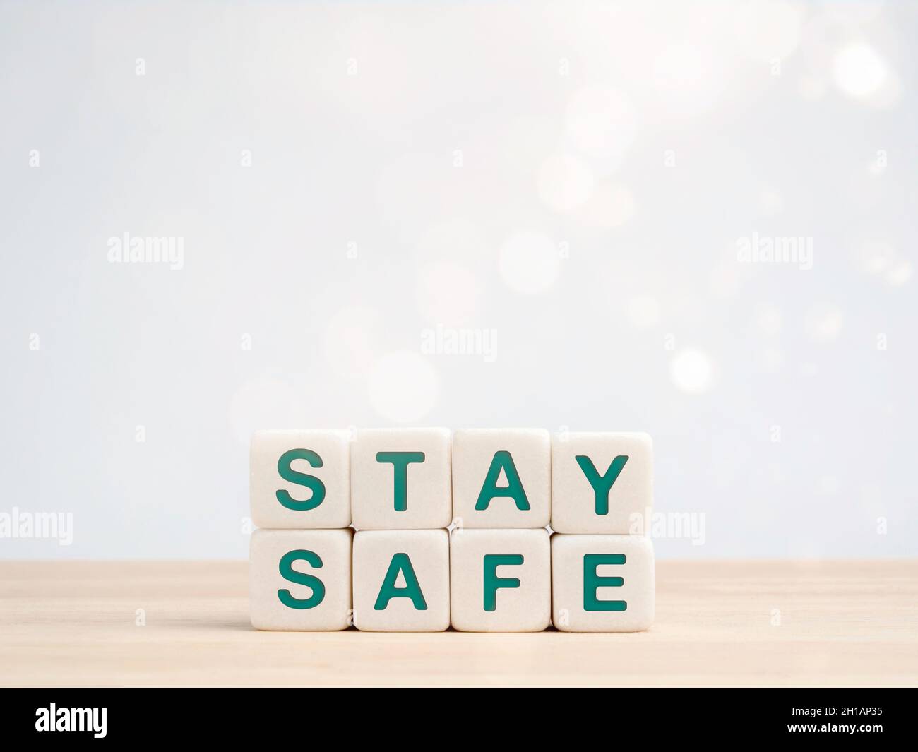 Stay safe concept. Green words, stay safe on white dice blocks on ...
