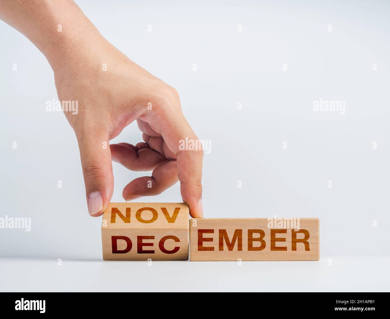 Hand changing white wooden calendar hi-res stock photography and images ...