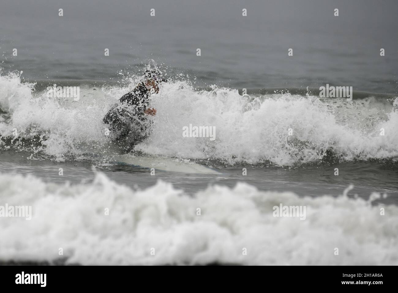 Man surfing on Ventura Beach in California, USA Stock Photo - Alamy