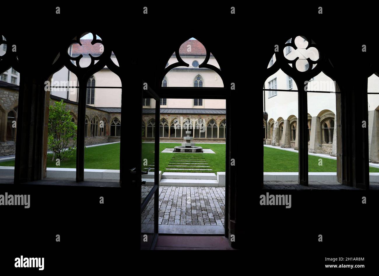 25 June 2021, Bavaria, Würzburg: View through the cloister to the inner ...