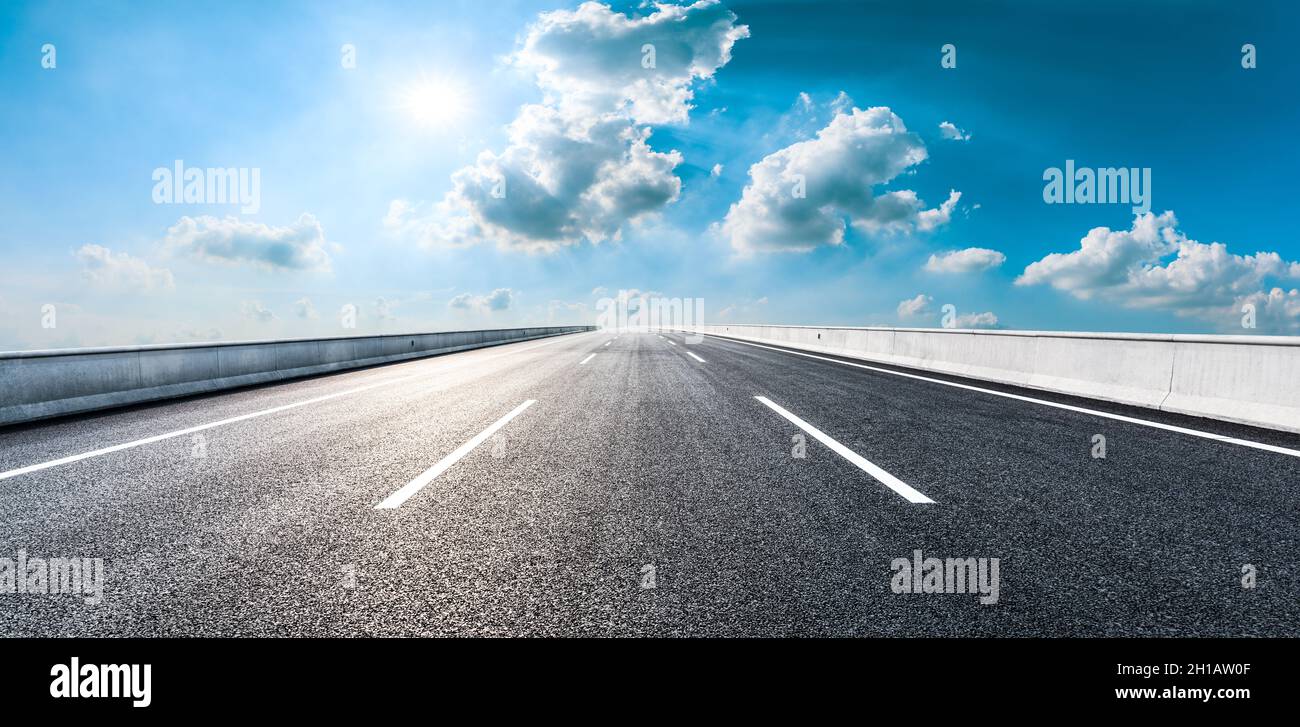 Empty asphalt road and blue sky with white clouds.Road background Stock ...