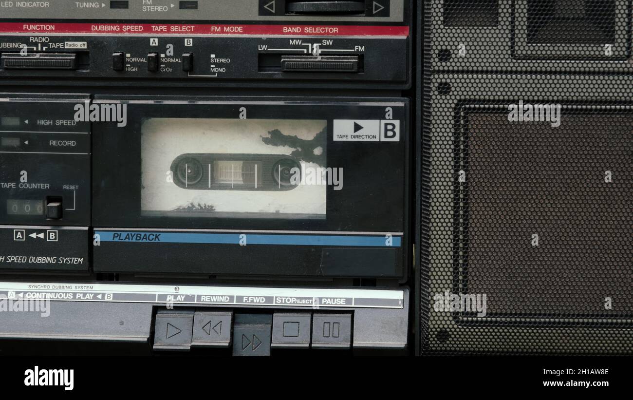 Old, retro tape recorder rewinds a tape cassette. Close up shot Stock ...