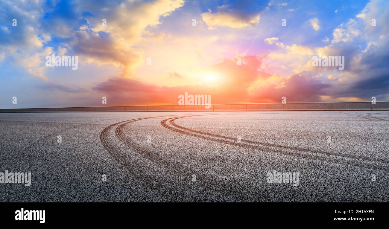 Asphalt race track road and sky clouds at sunset.Road ground background ...