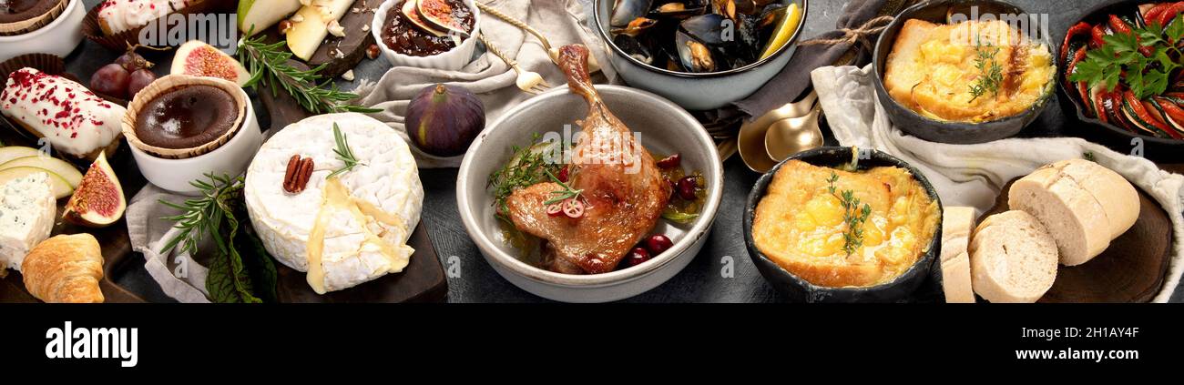 French food assortment on dark background. Traditional cuisine concept ...