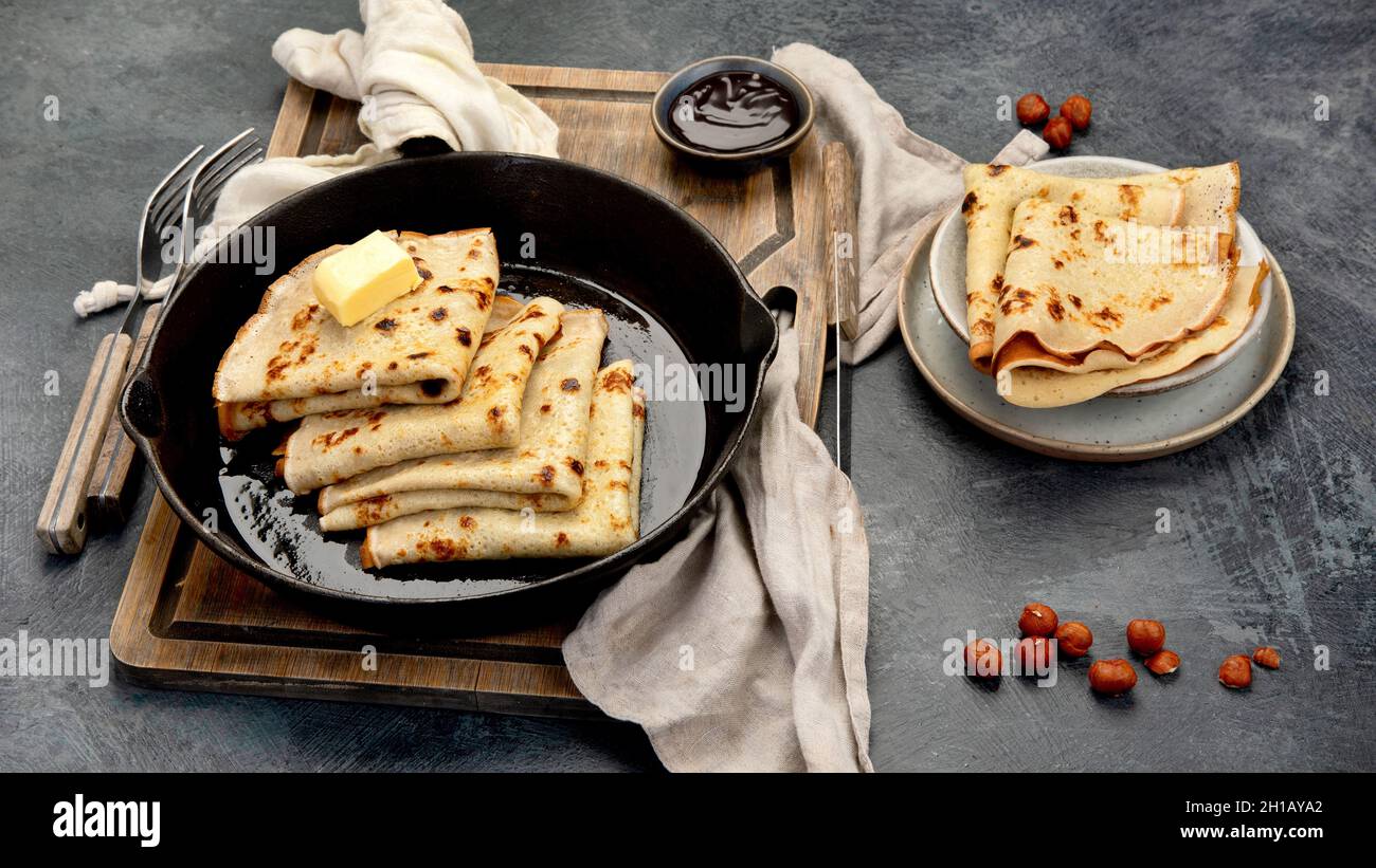 Crepes with sweet toppings on dark background. Homemade food concept ...