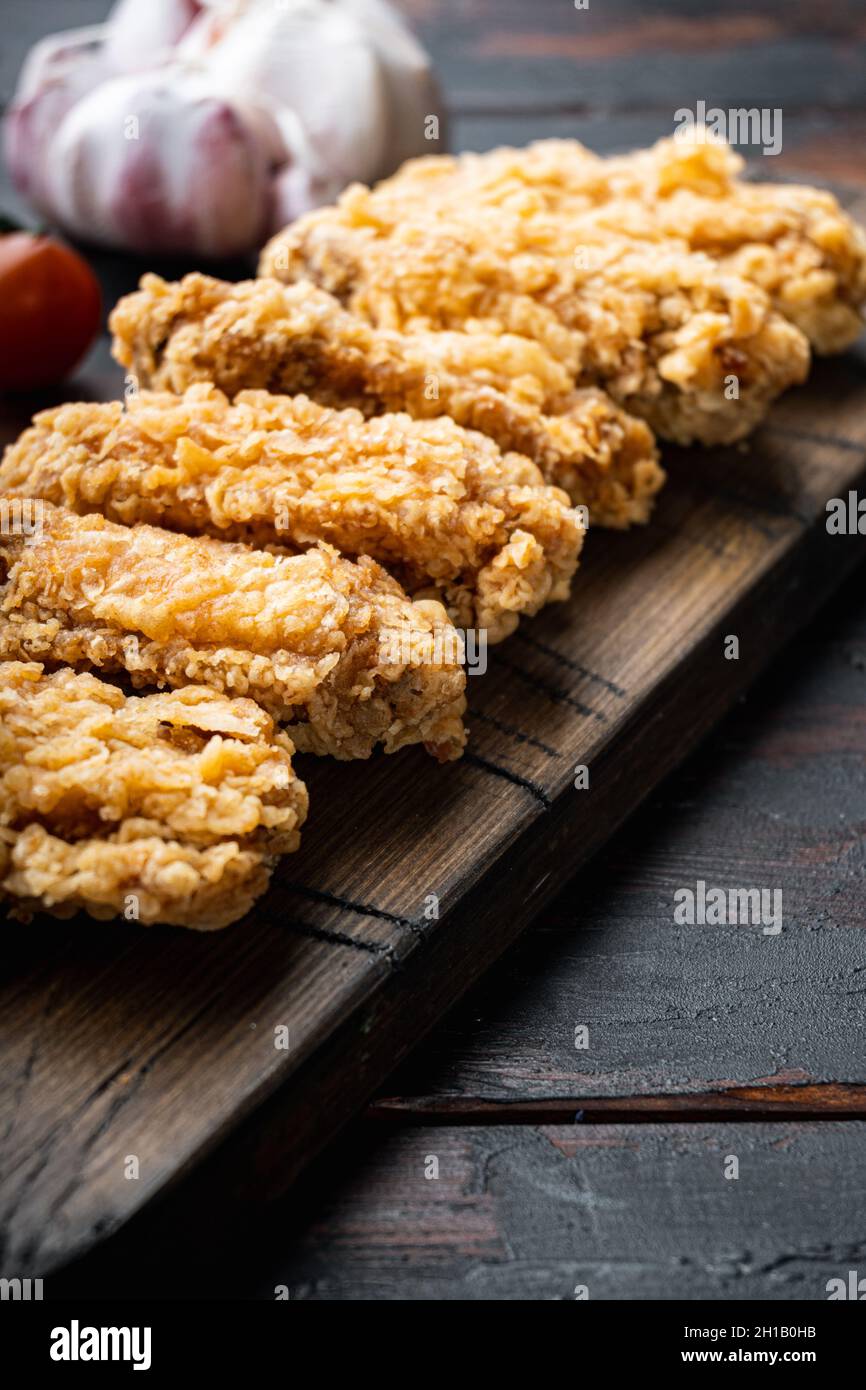 Fried chicken wings parts on dark wooden background Stock Photo - Alamy