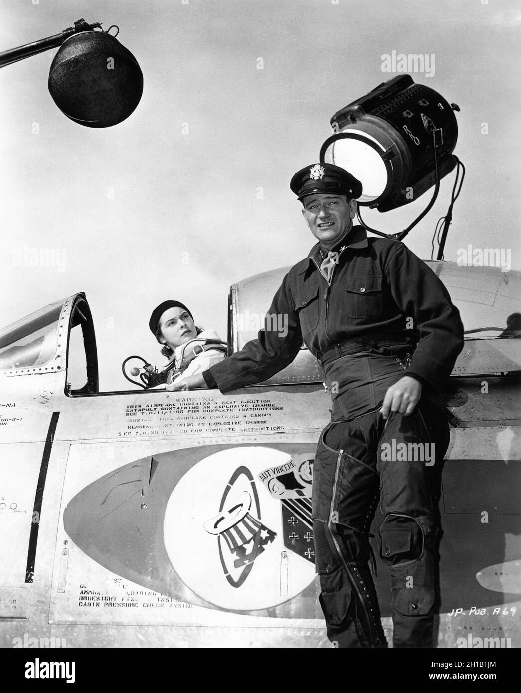 JANET LEIGH and JOHN WAYNE on set candid during filming of JET PILOT 1950 / 1957 director JOSEF ...
