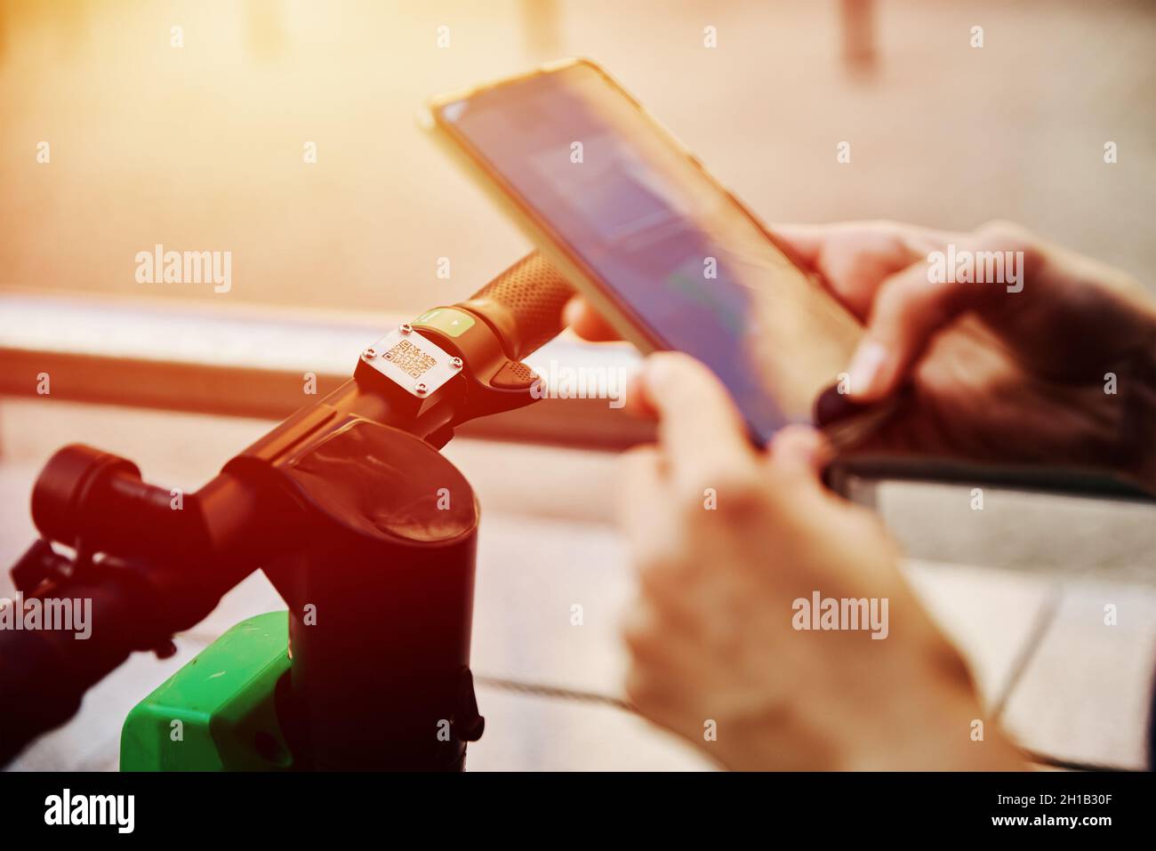 Woman unlock electric scooter for rent using mobile phone app. Modern ...