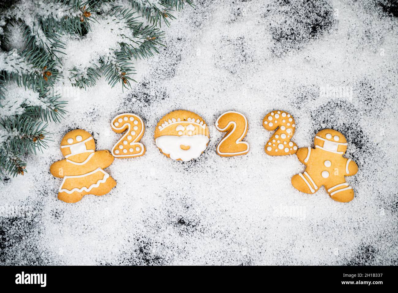 Christmas background with gingerbread on winter snow. Holiday mood card ...