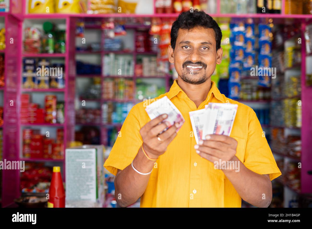 Happy smiling Groceries or Kirana Merchant small business owner ...