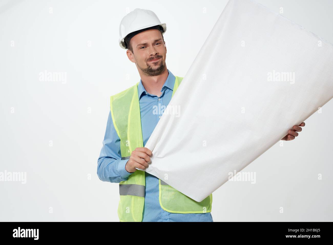 male builders blueprints builder isolated background Stock Photo - Alamy