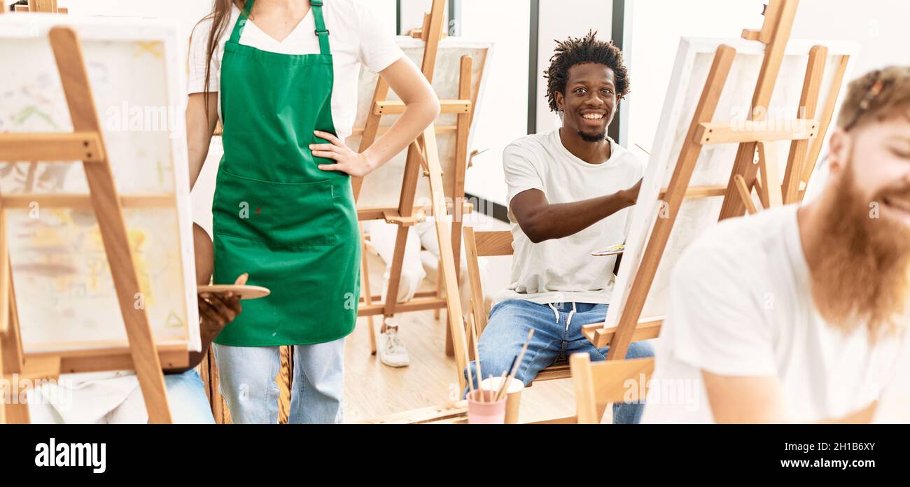 Group of people smiling happy drawing at art studio Stock Photo - Alamy