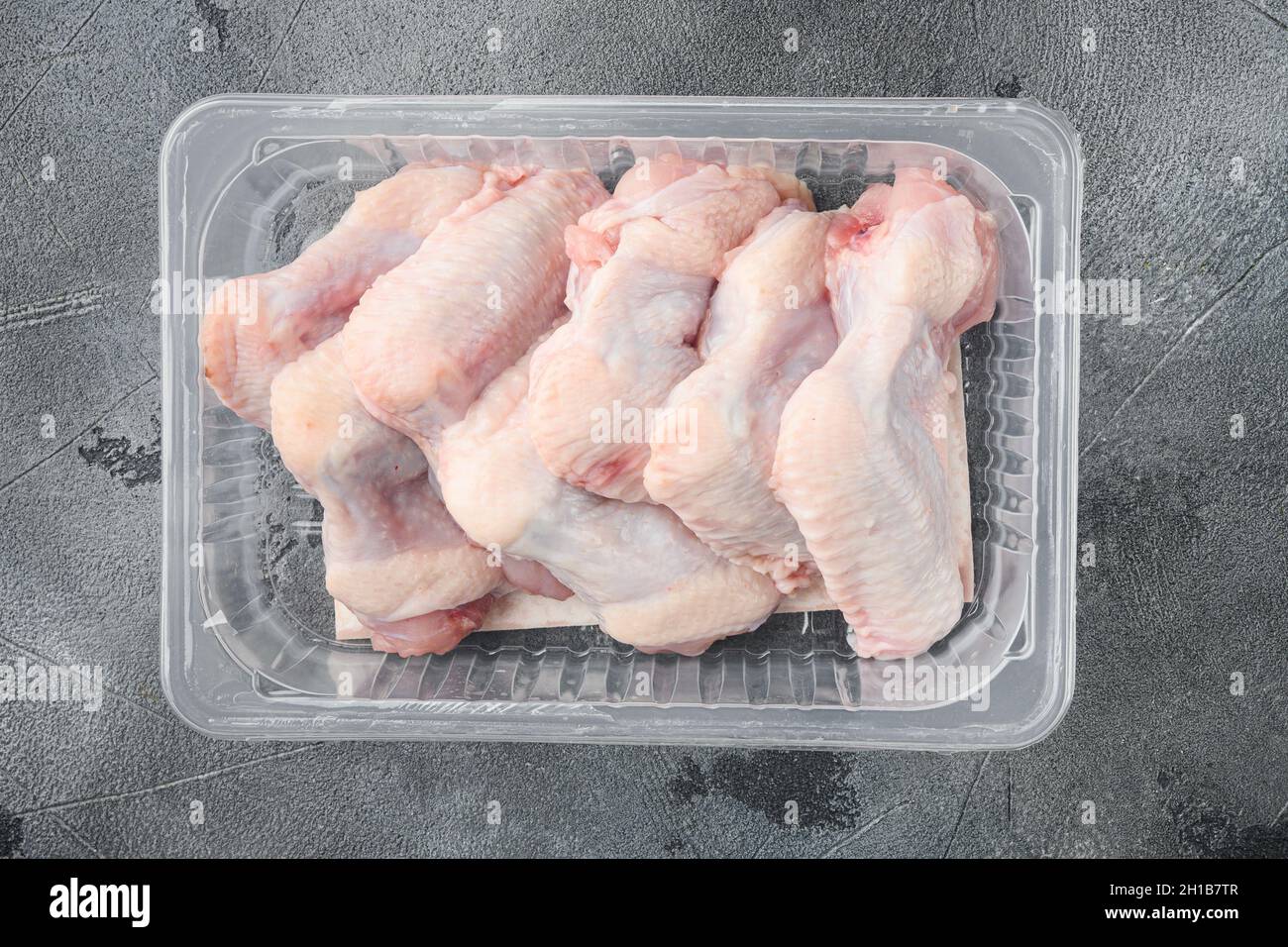 Fresh chicken wings package set, on gray stone background, top view ...