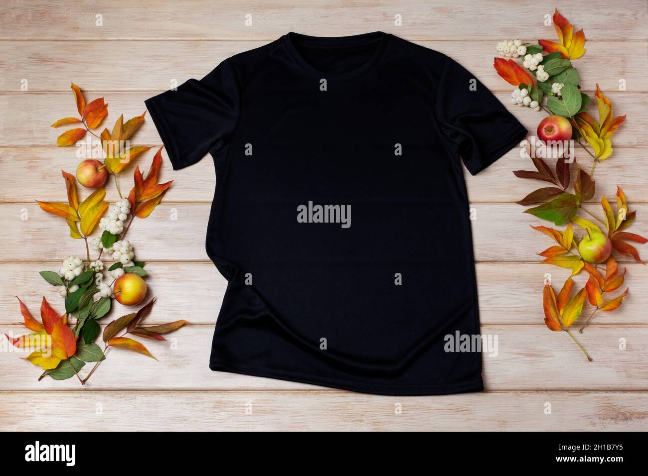 Black unisex cotton T-shirt mockup with snowberry, red and green fall ...