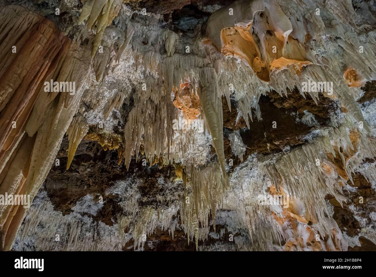Formation of stalactites and stalagmites inside an ancient cave Stock ...