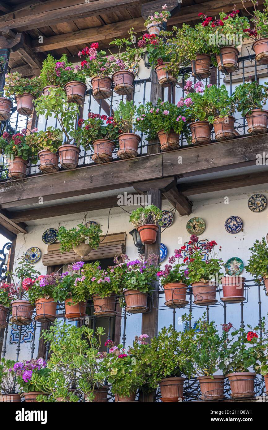 Facade of old building with flower pots. Tourism in central Spain ...