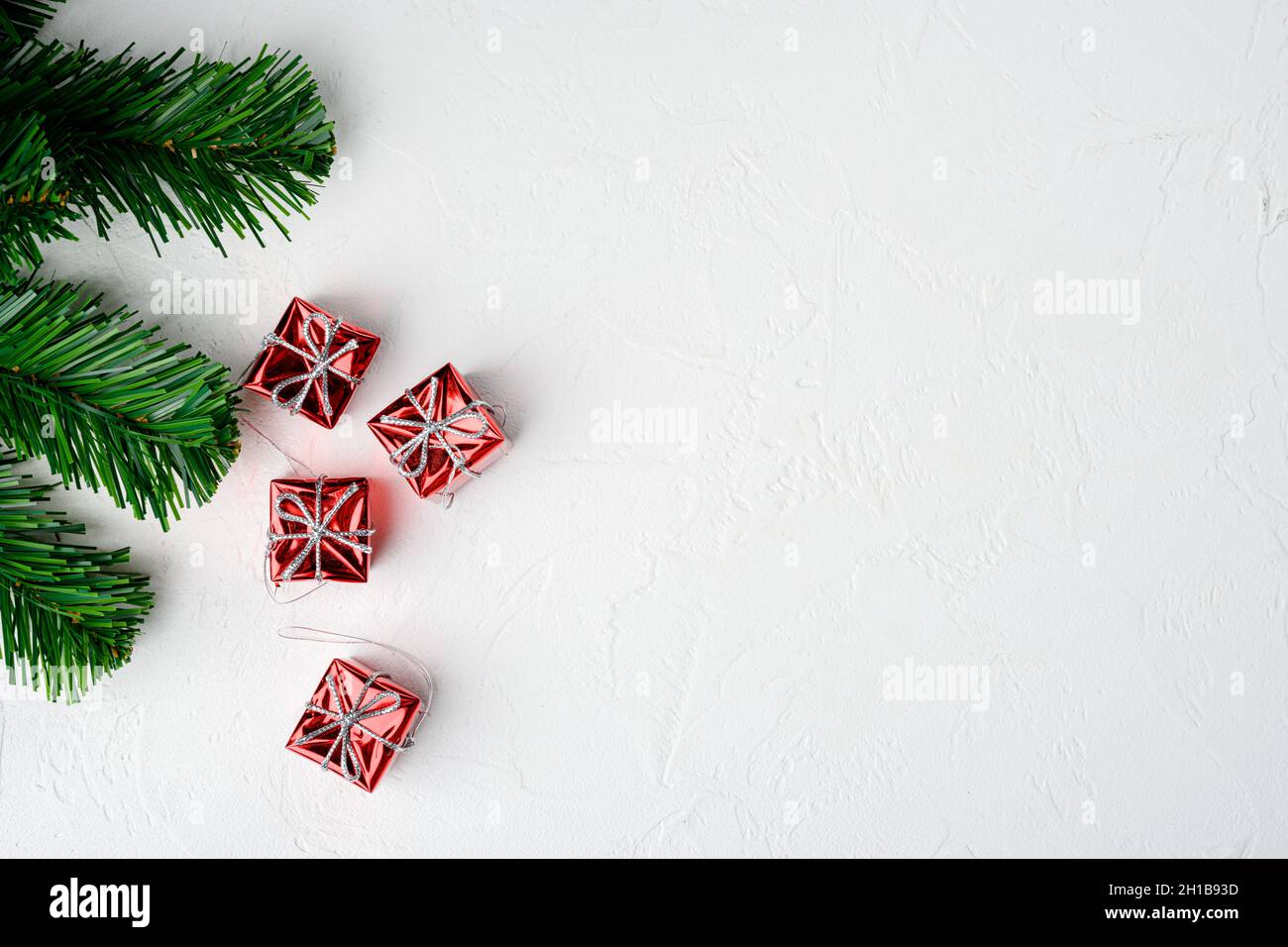 Christmas baubles and toys set, top view flat lay, on white stone table ...