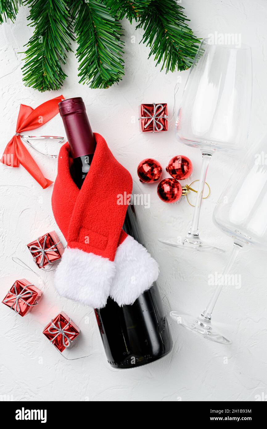 Christmas wine with New Year tree decor set, on white stone table ...