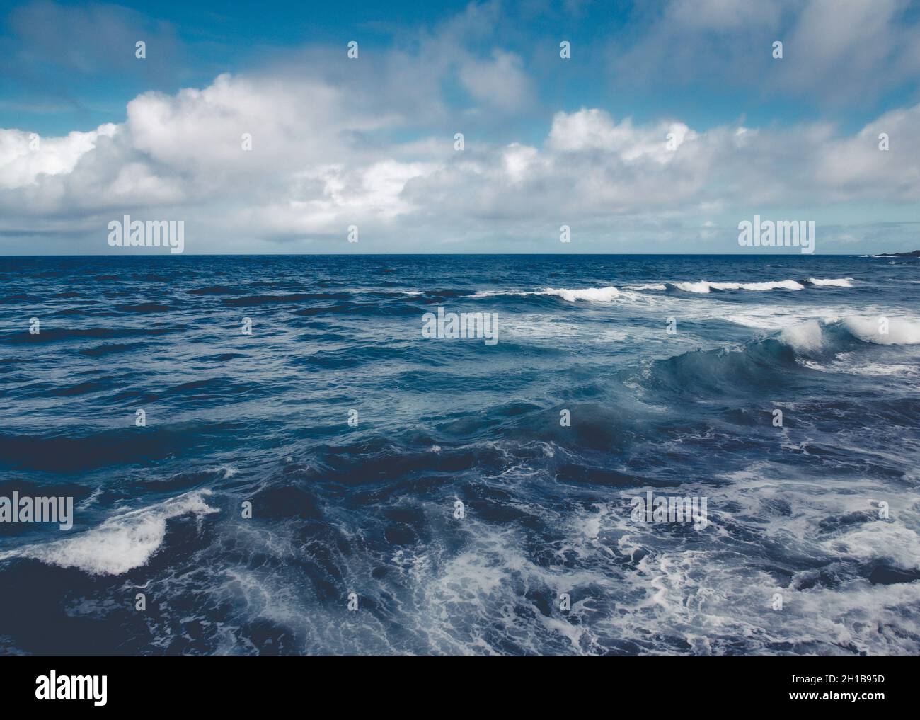 Blue ocean transparent water clouds hi-res stock photography and images ...