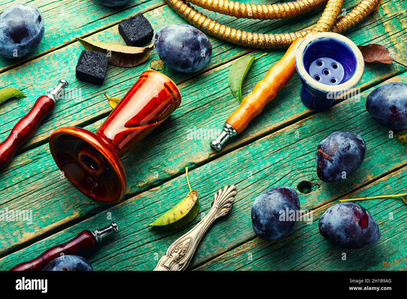 Smoking hookah with plum flavored tobacco.Asian kalian Stock Photo - Alamy
