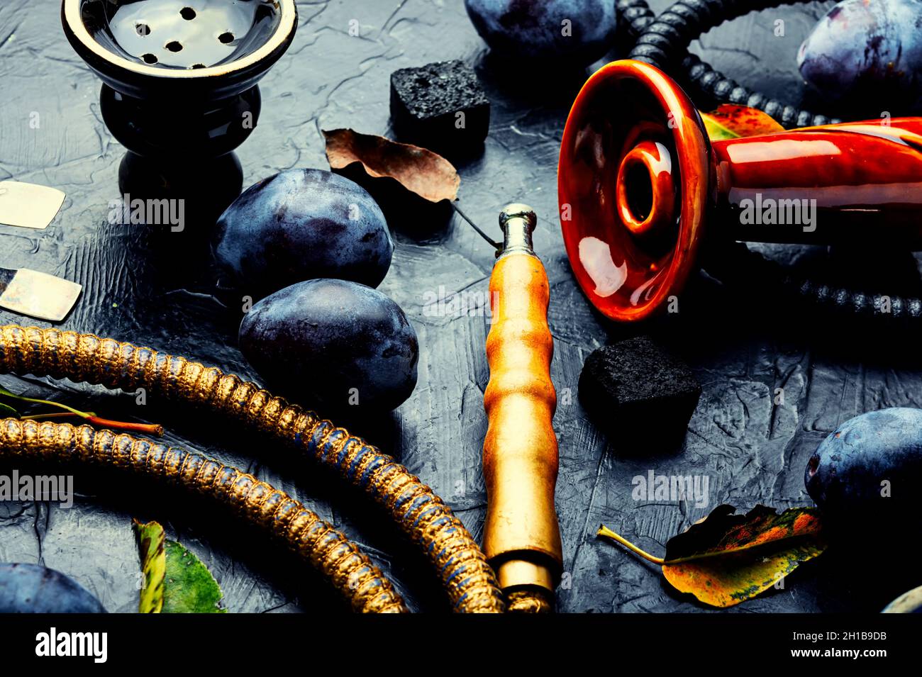 Smoking hookah with plum flavored tobacco.Fruit shisha Stock Photo - Alamy