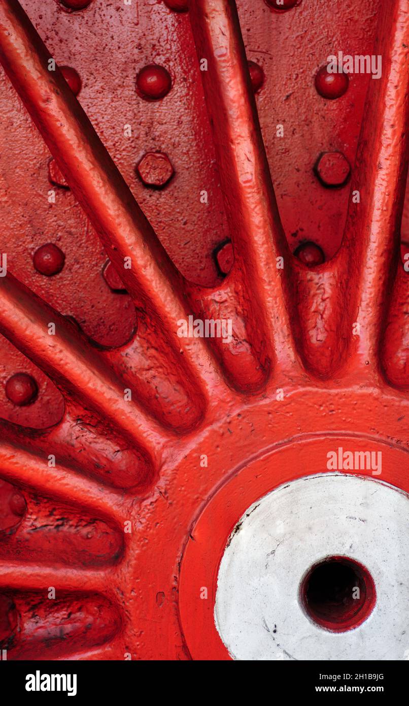 Backgrounds and textures: red steam locomotive wheel, close-up shot ...
