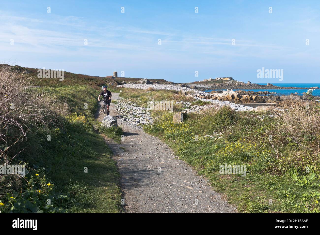 dh Cyclist VALE GUERNSEY North coast cycle path cycling people riding ...