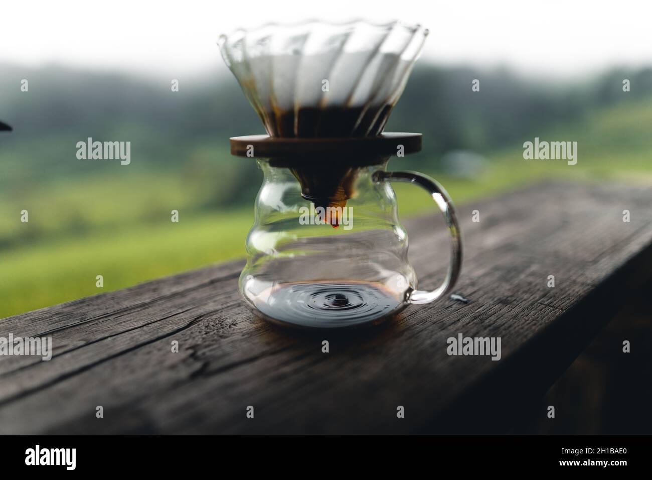 outdoor drip coffee maker on wooden table rice field background Stock ...