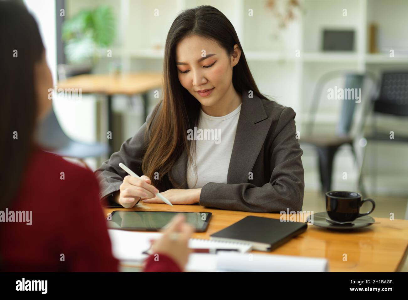 Young asian female startup learning business strategy from her mentor ...