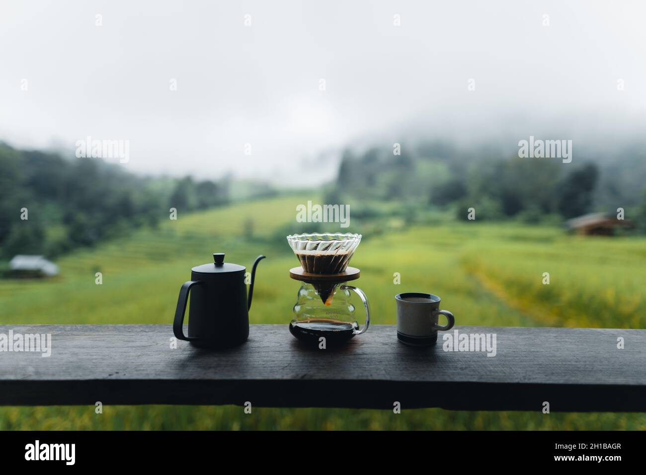 outdoor drip coffee maker on wooden table rice field background Stock ...