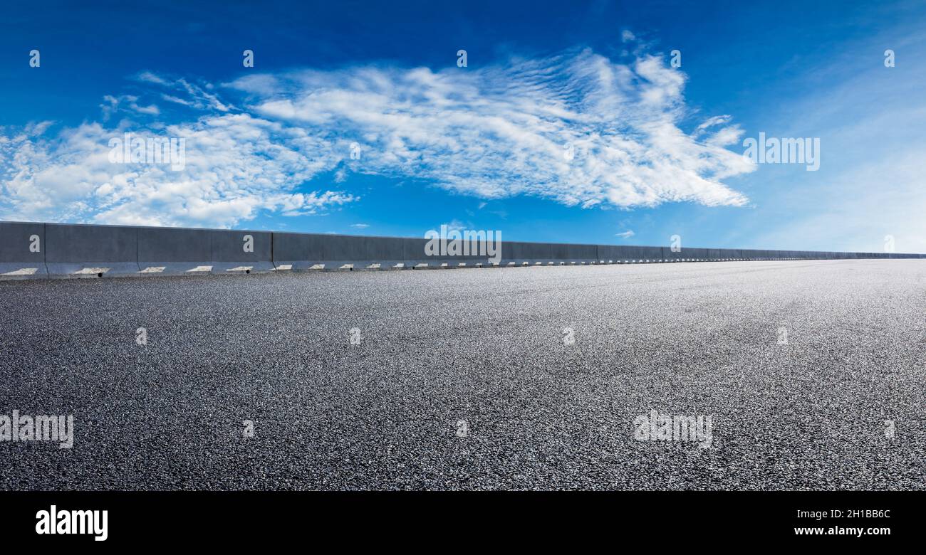 Asphalt highway ground and blue sky with white clouds scene Stock Photo ...