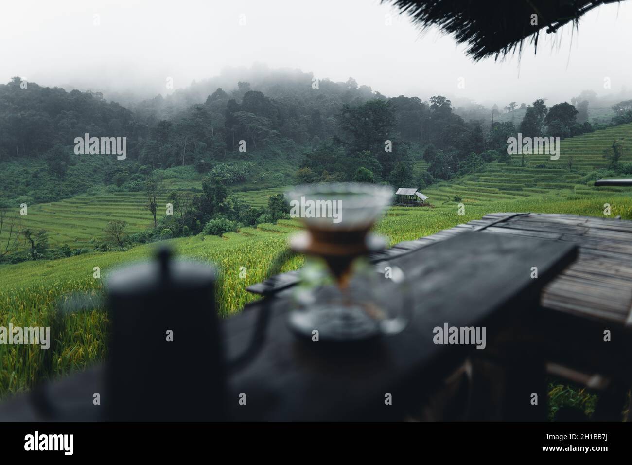 outdoor drip coffee maker on wooden table rice field background Stock ...
