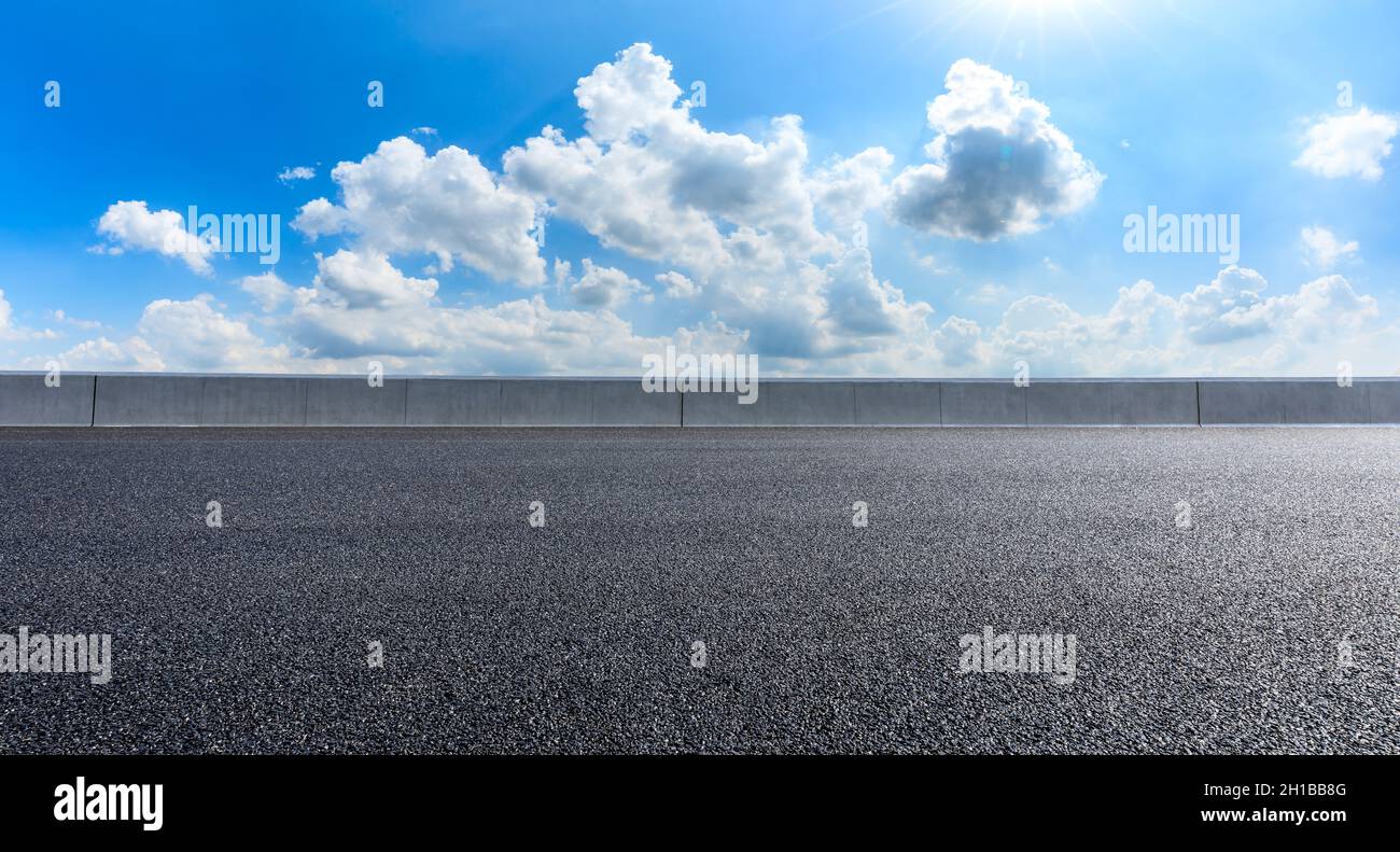 Asphalt highway ground and blue sky with white clouds scene Stock Photo ...