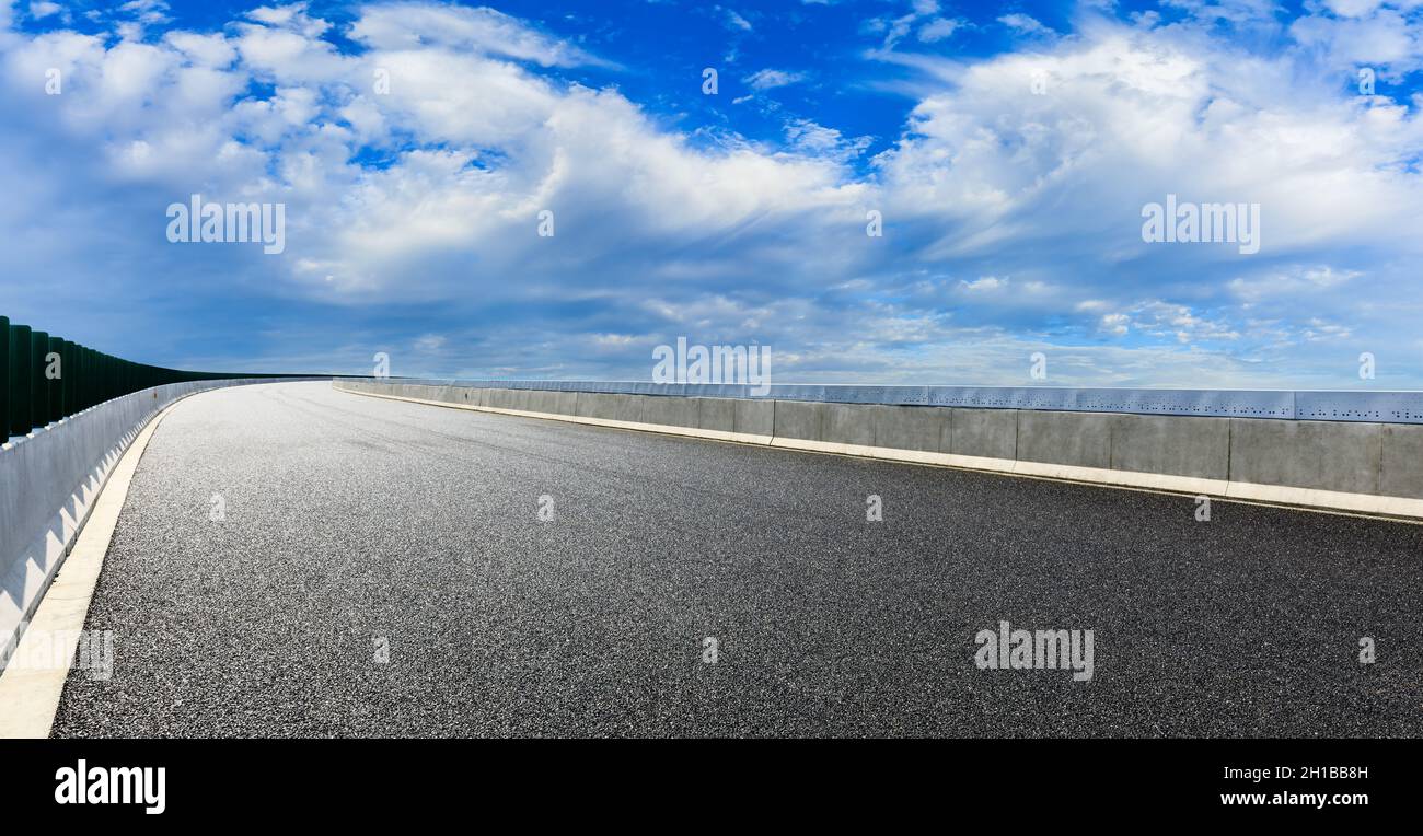 Asphalt highway ground and blue sky with white clouds scene Stock Photo ...