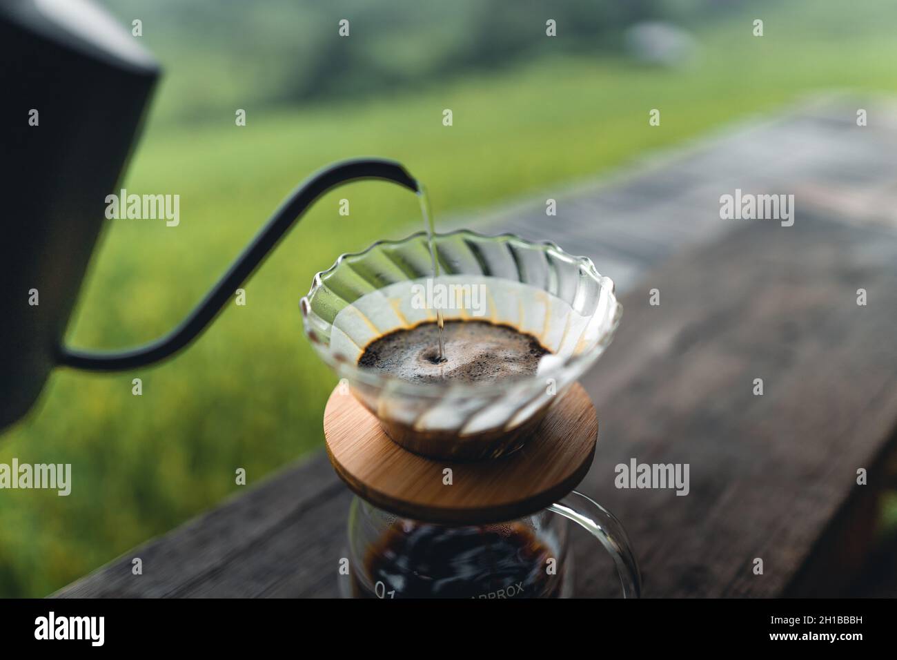 outdoor drip coffee maker on wooden table rice field background Stock ...