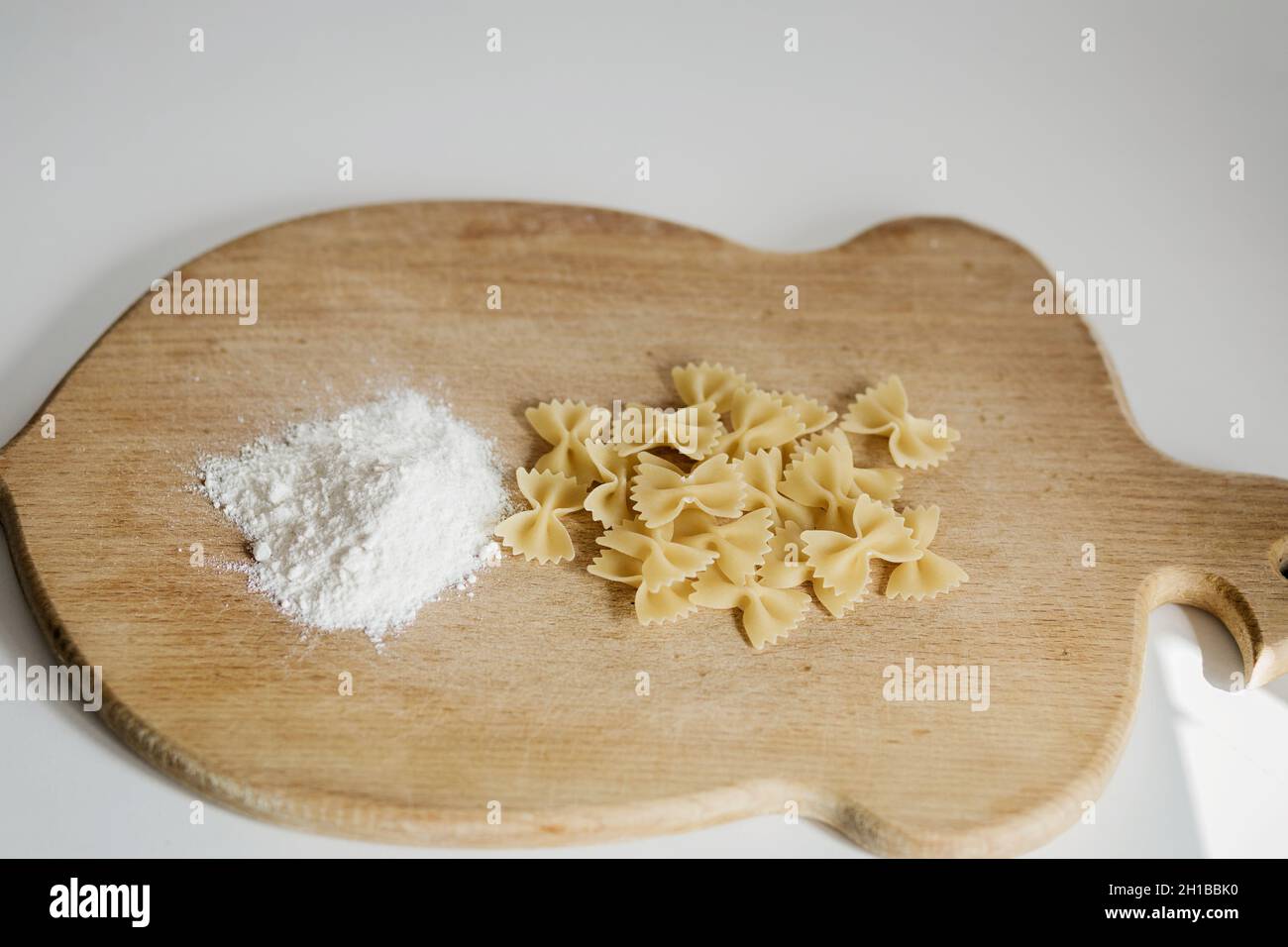Dry pasta on wood background. Italian Macaroni Stock Photo - Alamy