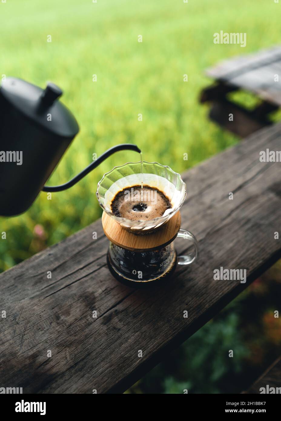 outdoor drip coffee maker on wooden table rice field background Stock ...