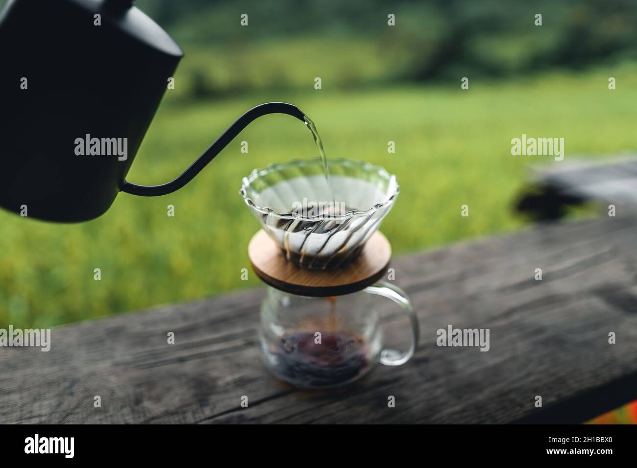 outdoor drip coffee maker on wooden table rice field background Stock ...