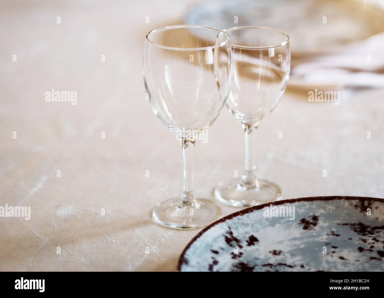 Two empty glasses in restaurant. Cafe interior Stock Photo - Alamy