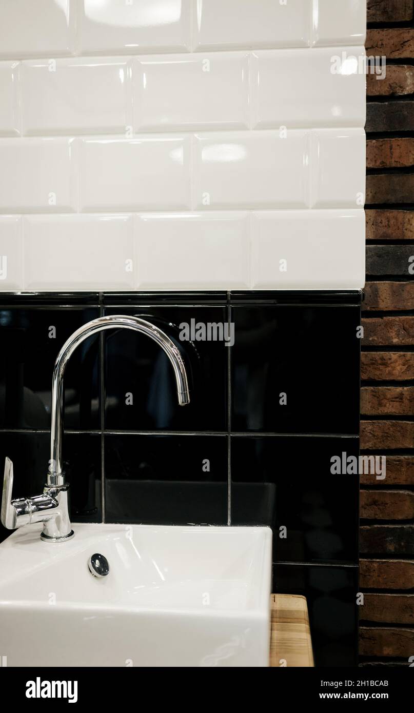 Metal faucet in a kitchen or bathroom Stock Photo - Alamy