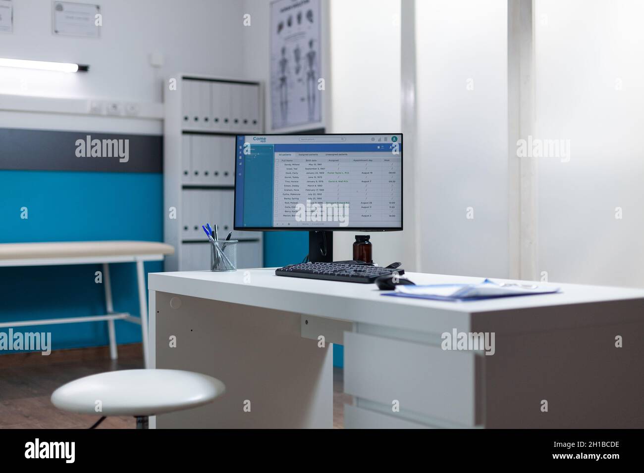 Empty desk with medical documents and clinical appointment on computer ...