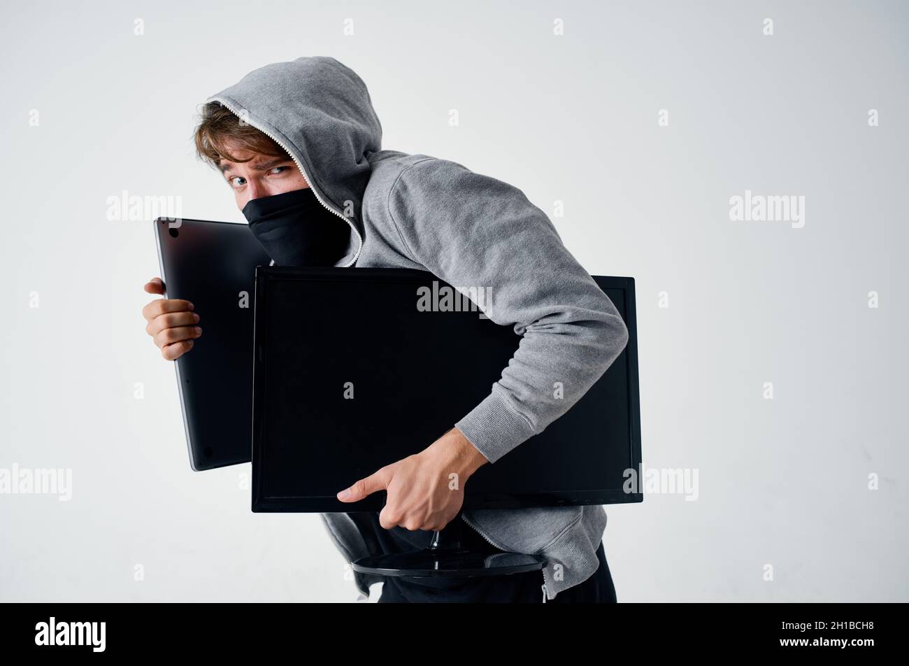 masked man hooded head hacking technology security isolated background Stock Photo - Alamy